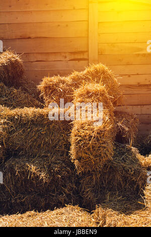 Dry baled hay stack, rural countryside background Stock Photo - Alamy