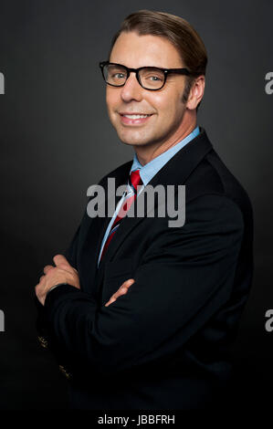 Handsome representative posing with folded arms isolated over white ...