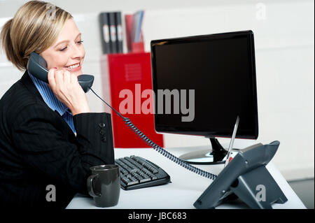 Female secretary answering bosses call and informing updates Stock ...