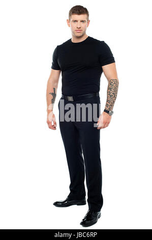 Strong male bouncer. Tattoo on both his hands Stock Photo - Alamy