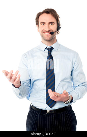 Male executive assisting business clients Stock Photo - Alamy