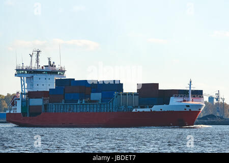 Red container ship sailing to the Baltic sea Stock Photo - Alamy