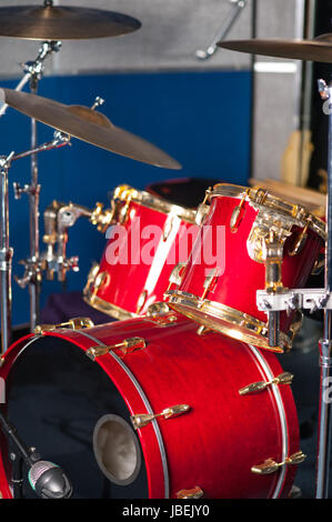 Red drum kit in recording studio Stock Photo - Alamy