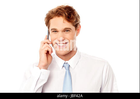 Young businessman assisting client over phone call Stock Photo - Alamy