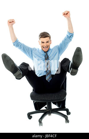 Successful businessman rejoicing, raising hands up and celebrating ...