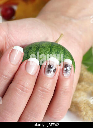 Manicured female hands with stylish green nails holding mobile phone ...