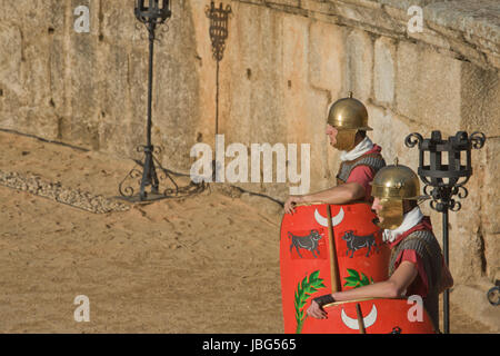 Roman Gladiators sword fighting on the stage at Aspendos theatre Turkey ...