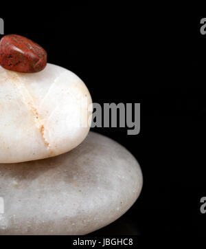 Concept made by many rocks isolated on black Stock Photo - Alamy