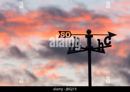 A compass silhouette seen at sunrise/sunset Stock Photo - Alamy
