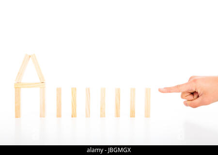 Finger ready to push dominoes in a row Stock Photo - Alamy