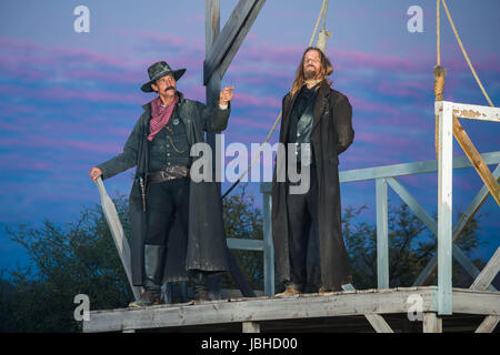 Bandit cowboy hanging in old west Stock Photo - Alamy