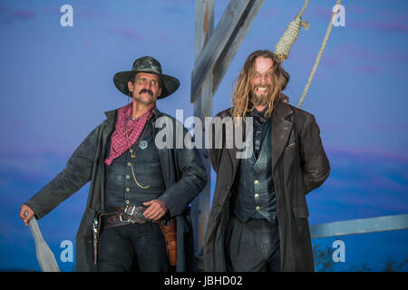 Bandit cowboy hanging in old west Stock Photo - Alamy