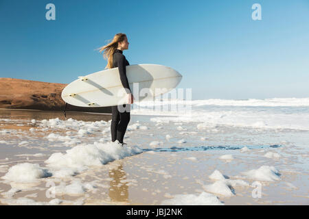 Teenage surfer girl checking the waves Stock Photo - Alamy
