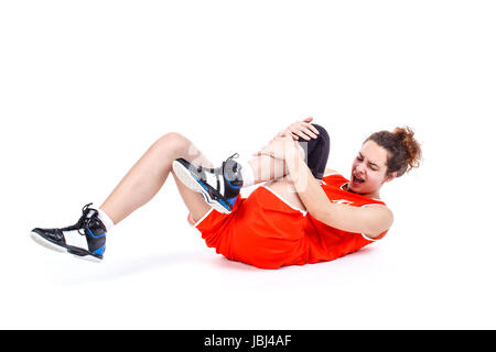 Basketball player with an expression of severe pain in his leg Stock ...