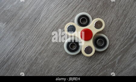 two hand spinner lying on grey laminate Stock Photo - Alamy