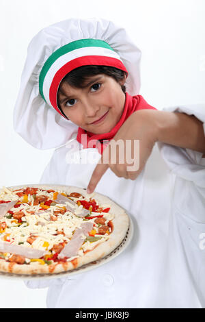 happy boy chef with pizza Stock Photo - Alamy
