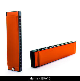 Orange Harmonica On a White background Stock Photo - Alamy