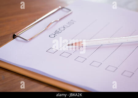 Checklist concept - checklist, paper and a pen with checklist word on ...