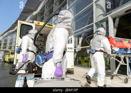 HAZMAT team with stretcher and rescue equipment entering contaminated ...