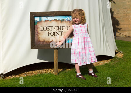 Lost child point sign: A two-year-old girl / kids / infant who appears ...