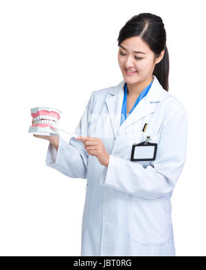 Asian female doctor teaching human anatomy using organ model laptop ...