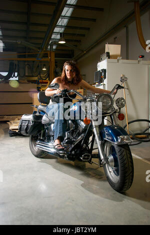Beautiful brunette girl on a Harley-Davidson Road King motorcycle ...