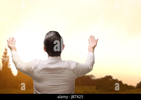 Back view of young muslim man praying isolated over white background ...