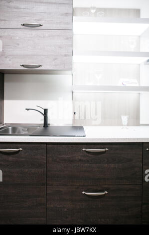 Angle view of kitchen sink with silver faucet in kitchen room, modern ...