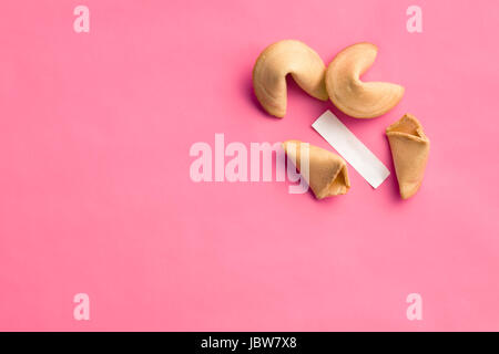 Fortune cookies on pink background Stock Photo - Alamy