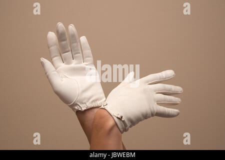 A woman's hands and forearms are shown as she models a vintage pair of ...