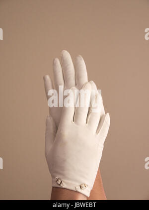 A woman's hands and forearms are shown as she models a vintage pair of ...