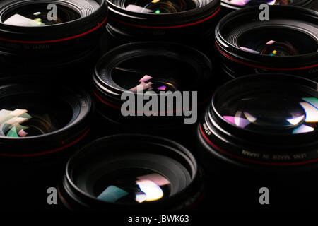 Modern camera lenses with reflections, low key image Stock Photo - Alamy
