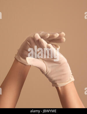 A woman's hands and forearms are shown as she models a vintage pair of ...