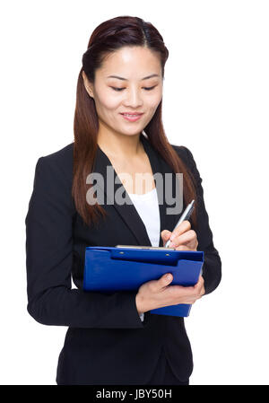 Businesswoman hold with file pad and pen point up Stock Photo - Alamy