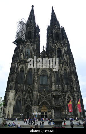 Koln Cologne Cathedral twin spires silhouetted floodlit against evening ...