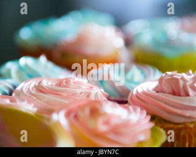 A top view of a nicely decorated white plate of whole and sliced lemons ...