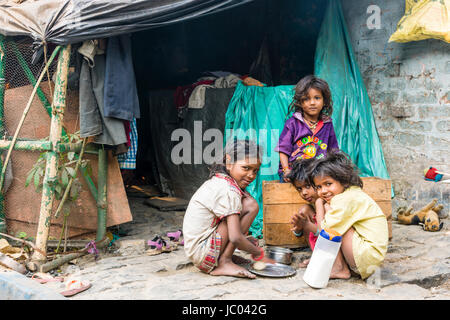 Children playing outside their slum dwellings in Laursa Place ...