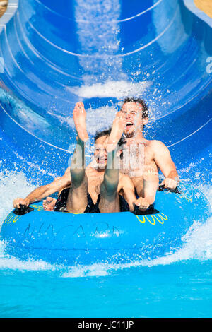 Man water sliding at aqua park Stock Photo - Alamy