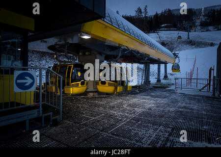 Yellow ski lifts at night on high snowy mountain at Austrian Alps Stock ...