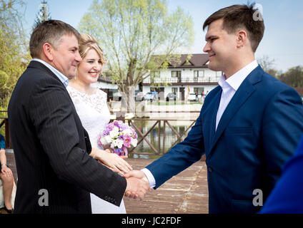Wedding ceremony. Wedding congratulation shaking hands. Wedding ...
