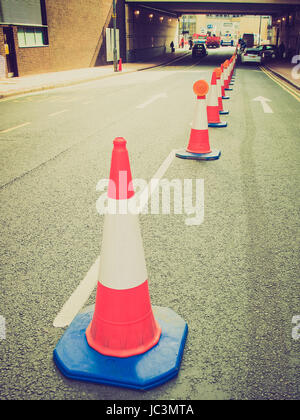 Vintage retro looking Traffic cone isolated over a white background ...