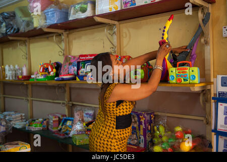 A female shop keeper, Nigeria, Africa Stock Photo - Alamy