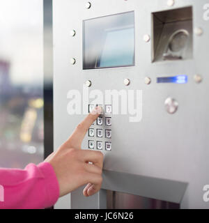 Women's hand using a dial pad Stock Photo - Alamy