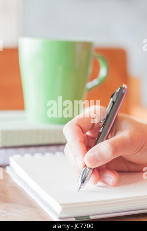 Hand writing with green mug background, stock photo Stock Photo - Alamy