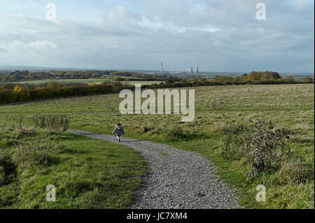Oxfordshire, child walks past Wittenham Clumps is the common name for a ...