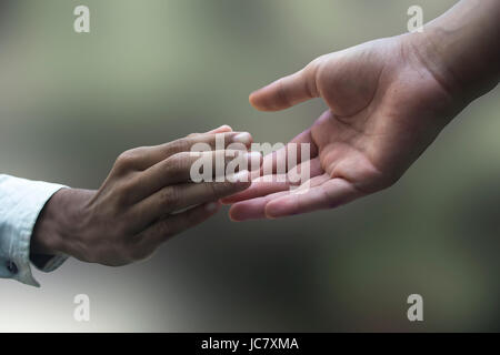 Helping hands, Rescue gesture. Black and white human hands. African and ...