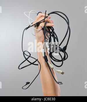 Man hold with lots of cable wire Stock Photo - Alamy