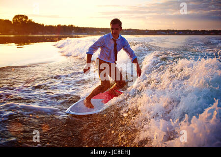 Male surfboarder practicing surfboarding Stock Photo - Alamy