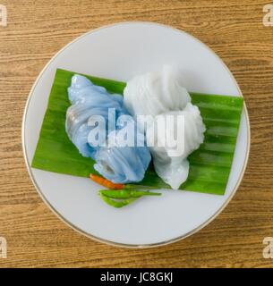 Top view of steamed glutinous rice dumpling Zongzi with bamboo leaves ...
