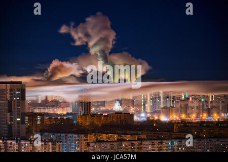 Smoke and haze over city at night at very cold winter weather Stock ...